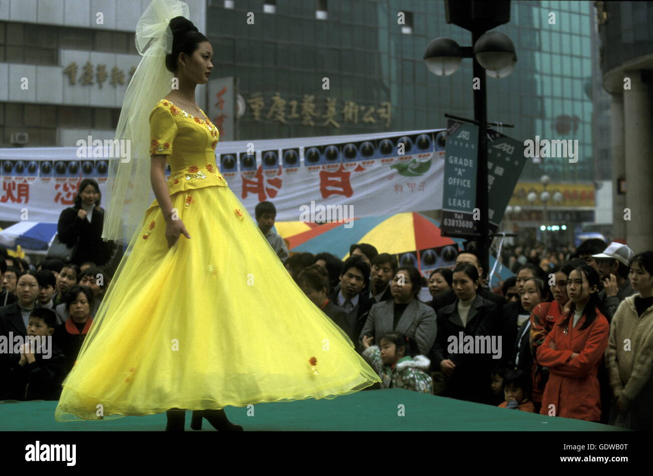 People at a fashion show at the main square in the city of Chongqing in ...