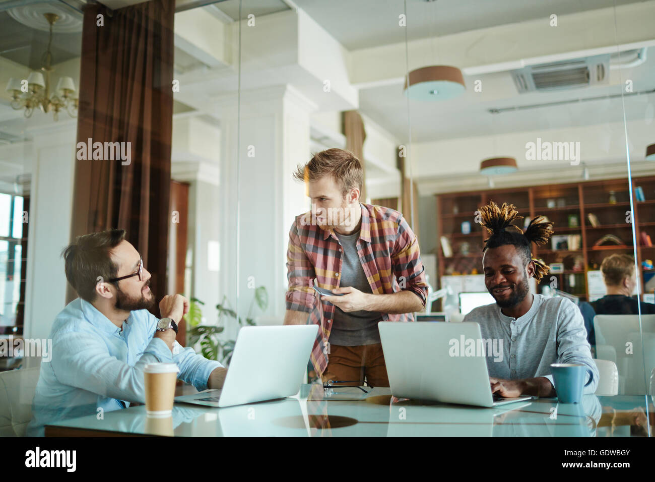 Employees working in office Stock Photo - Alamy