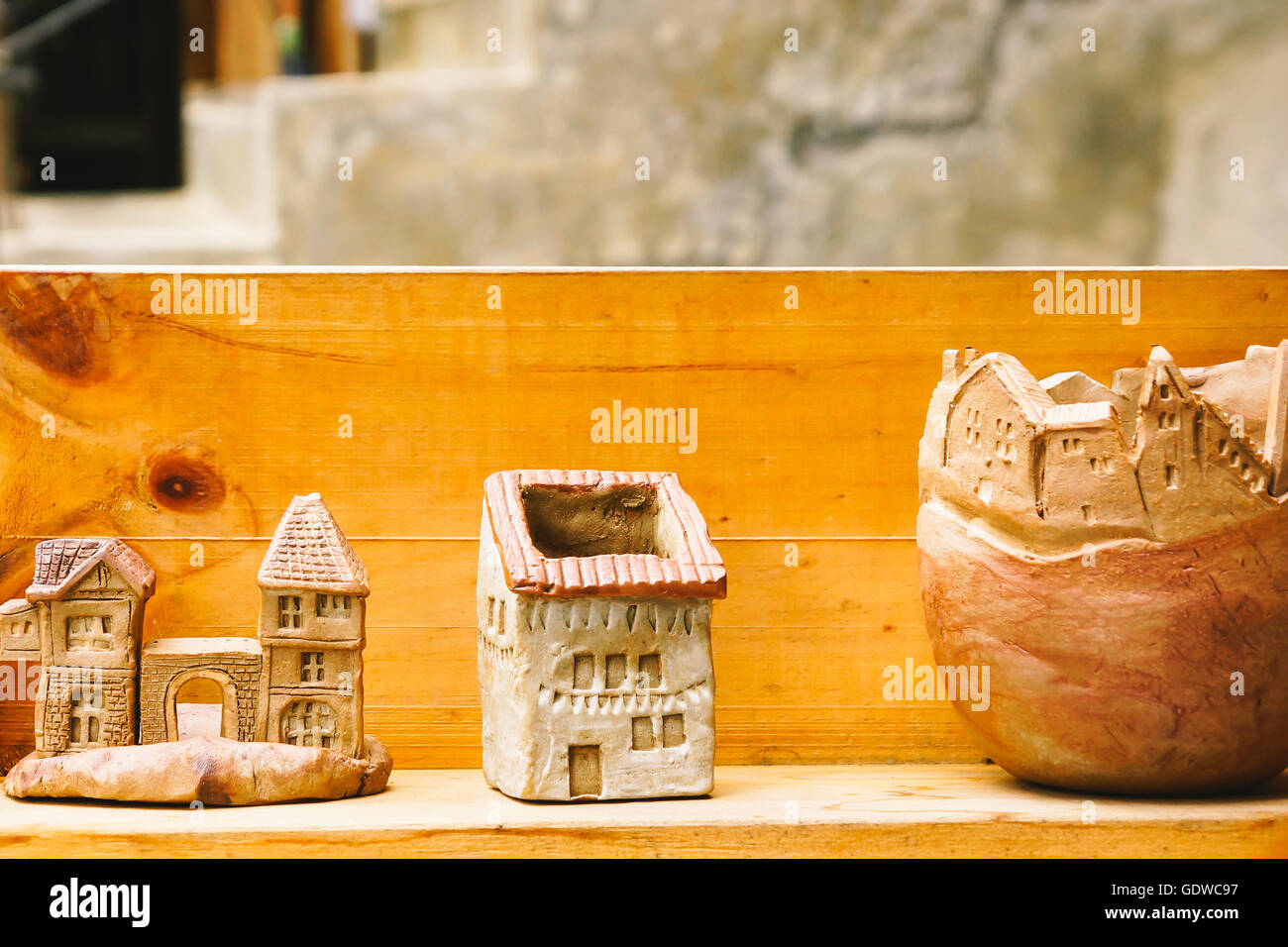 Small clay house model in woodshelf interior decorate Stock Photo - Alamy