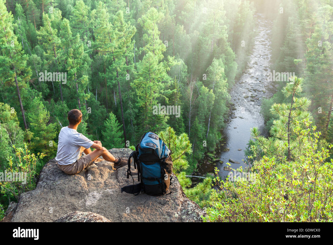Backpacker looks at beautiful view Stock Photo - Alamy