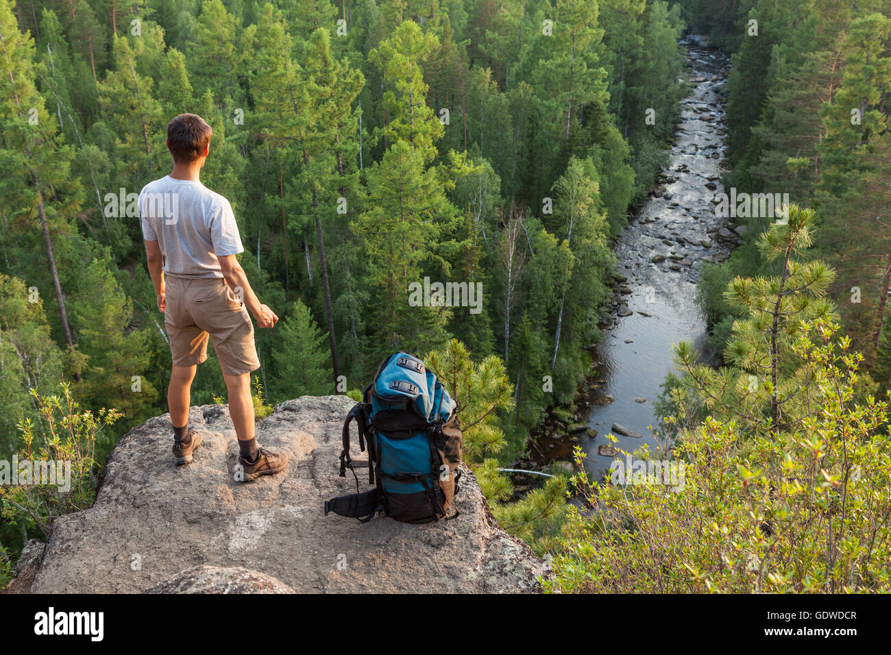 Hiker on big rock Stock Photo - Alamy
