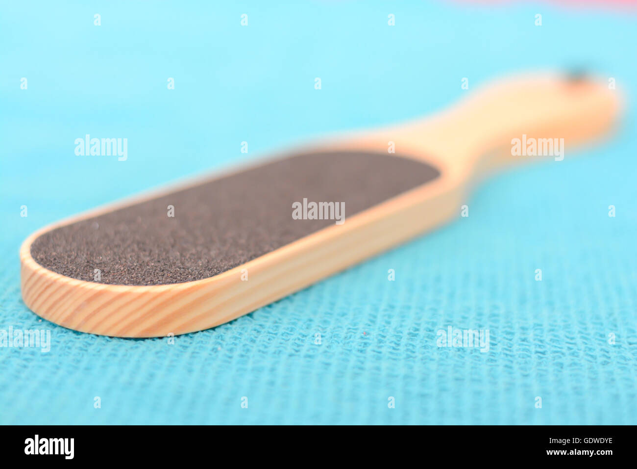 Foot file isolated on blue background Stock Photo - Alamy