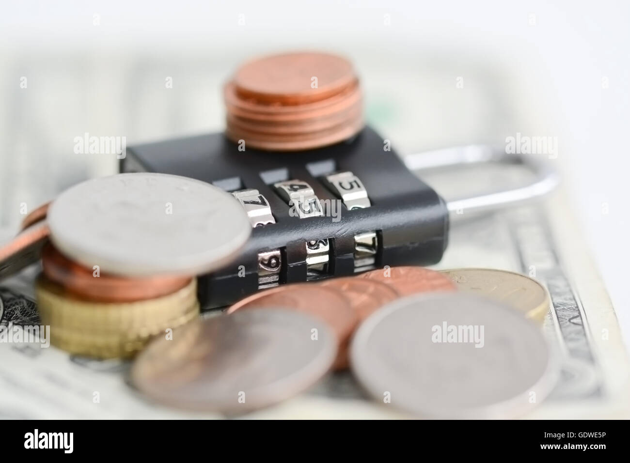 Secure your savings concept with cipher lock and money Stock Photo - Alamy