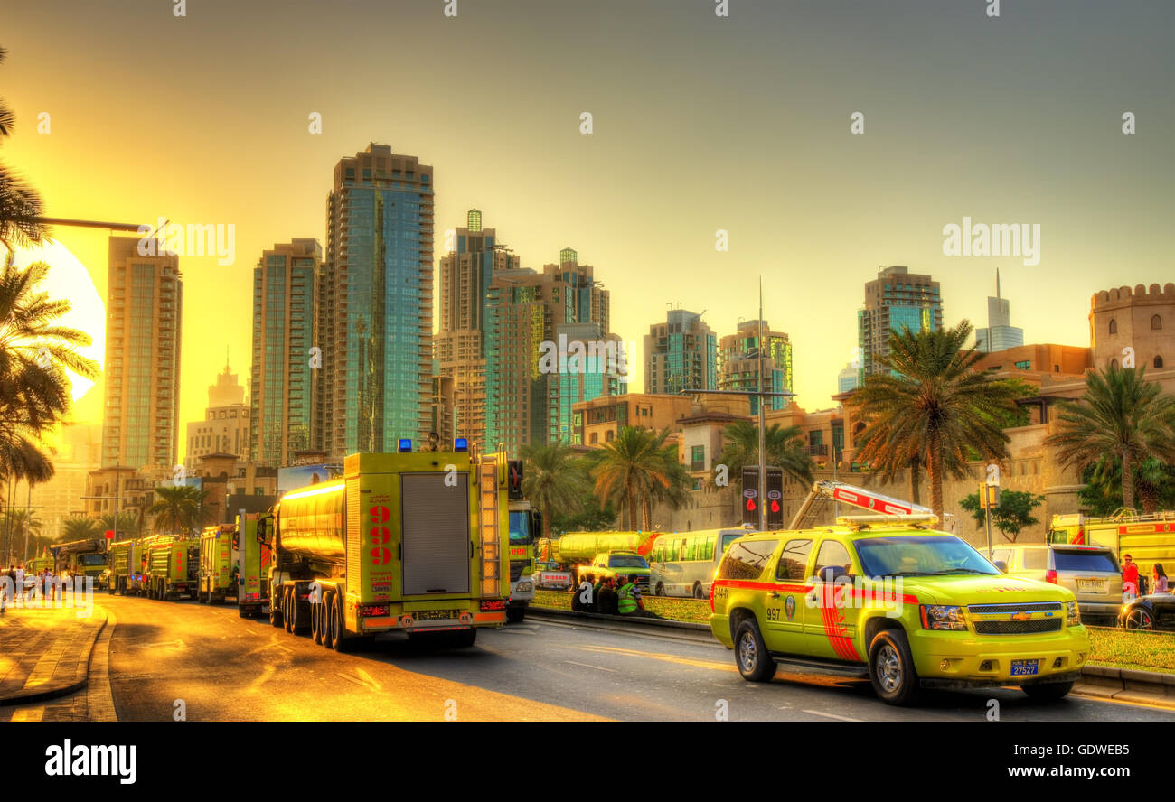 DUBAI, UAE - JANUARY 1: Fire and rescue services near burning Ad Stock ...