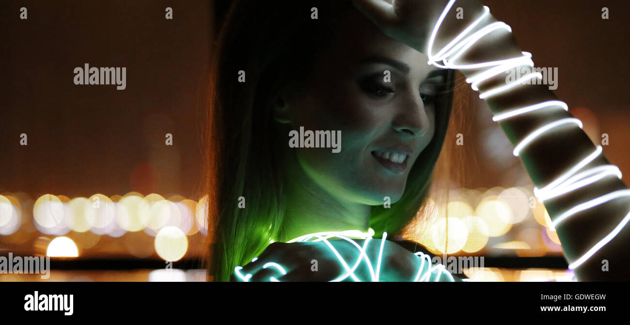 Girl with neon lights Stock Photo - Alamy