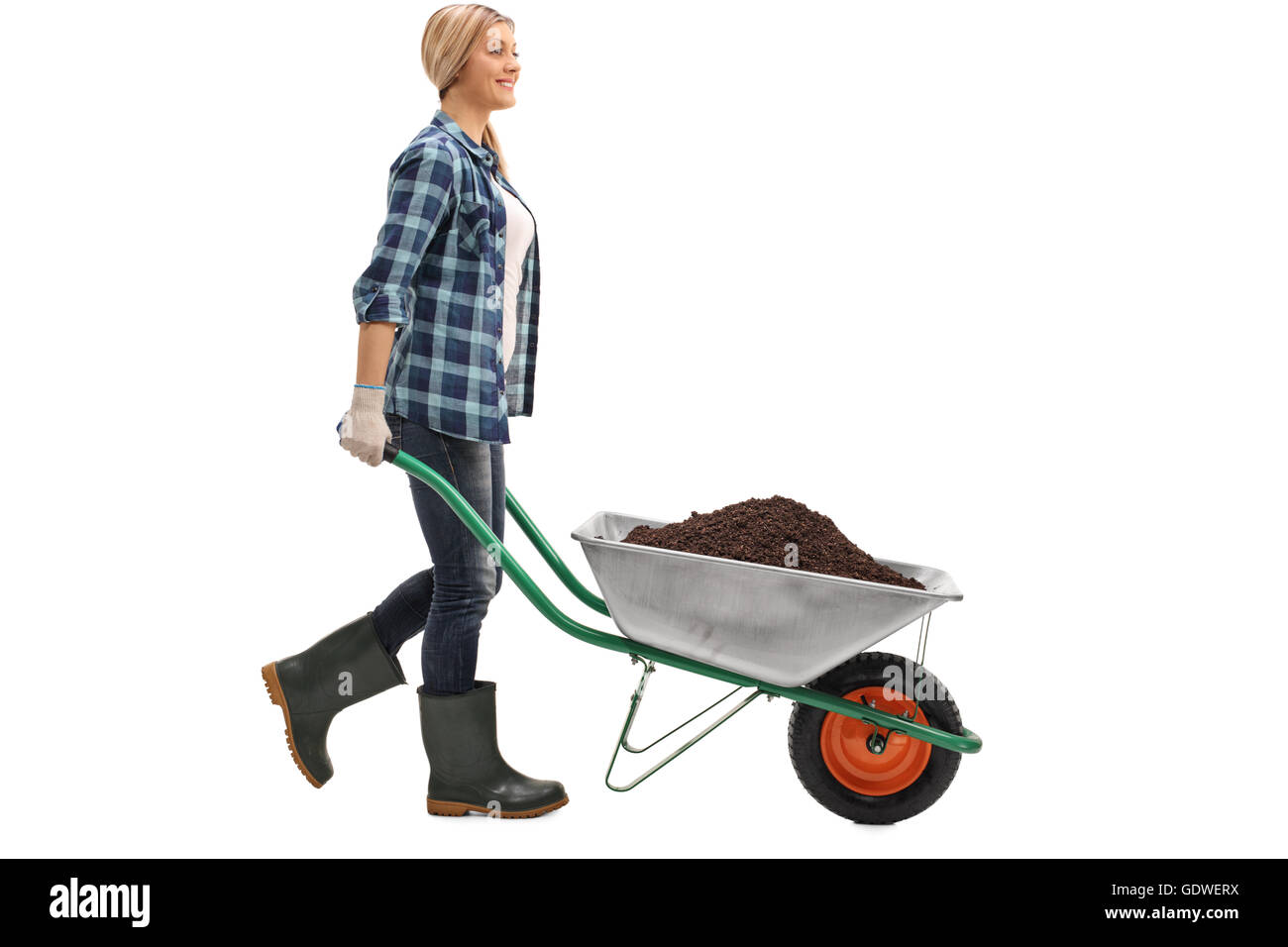 Woman pushing a wheelbarrow hi-res stock photography and images - Alamy