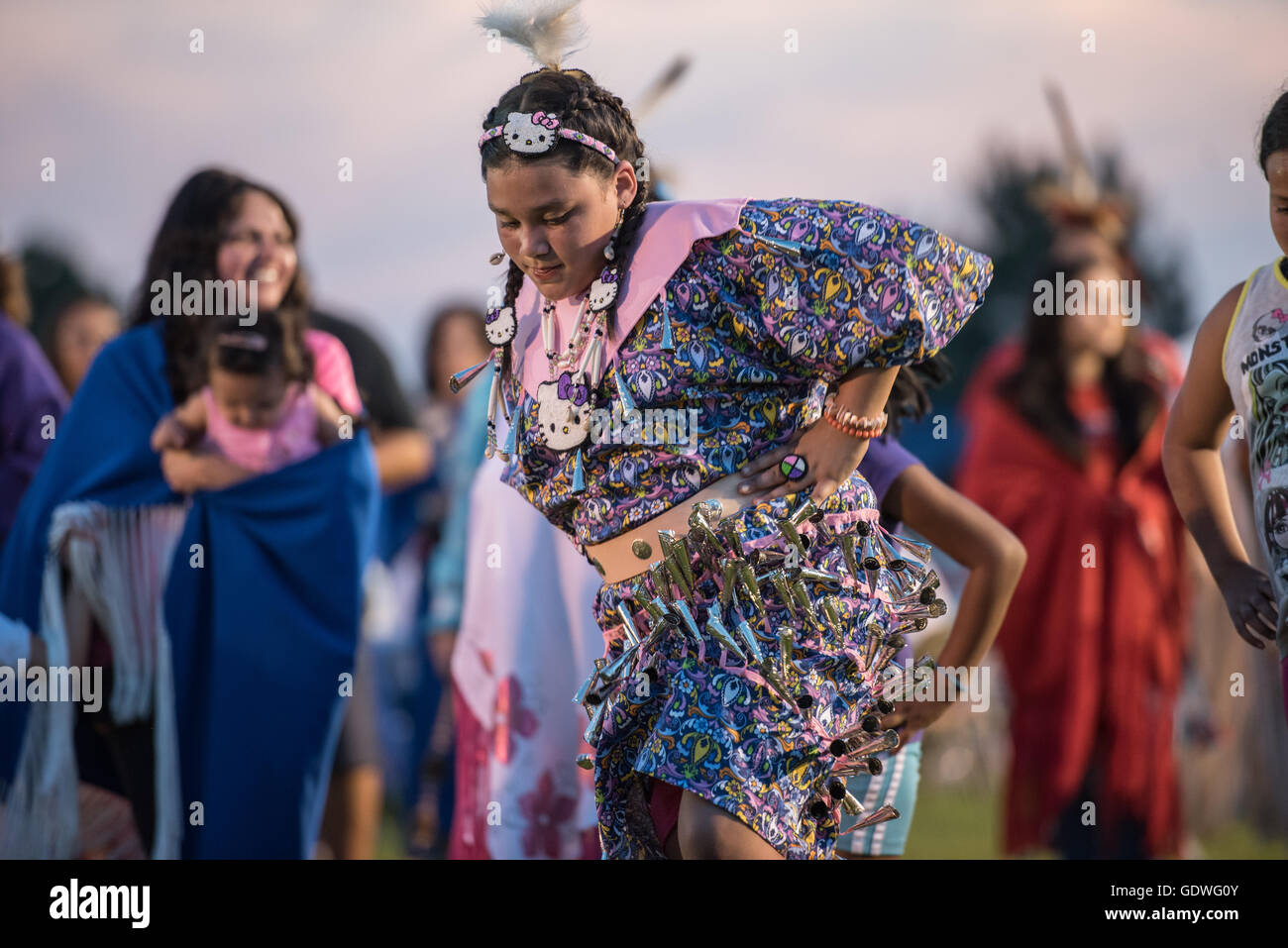 Native American woman performing jingle dress dance during Sac & Fox ...