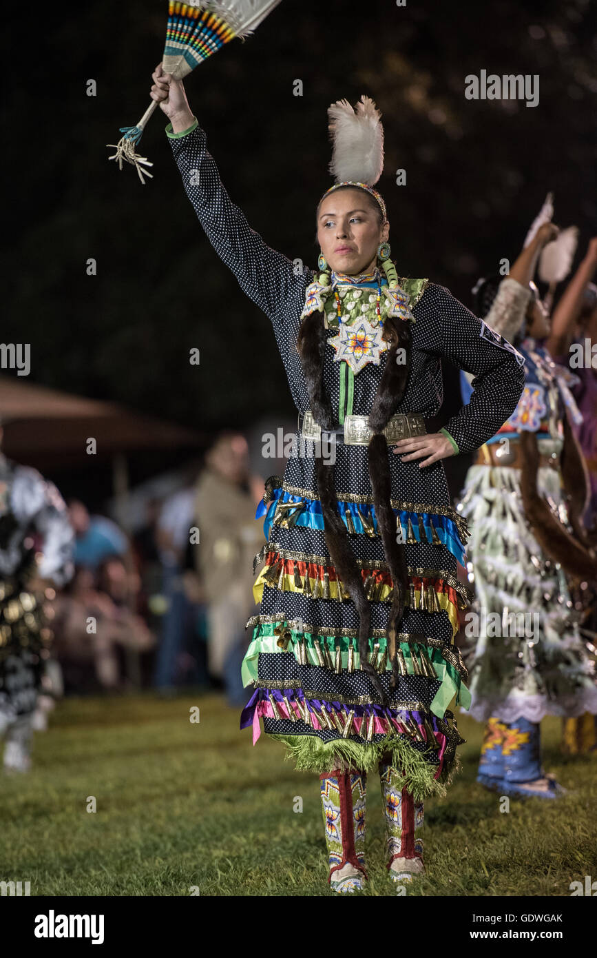 Native American woman performing jingle dress dance during Sac & Fox ...