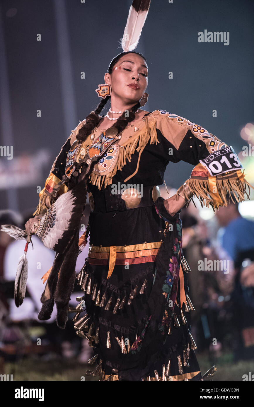Native American woman performing jingle dress dance during Sac & Fox ...
