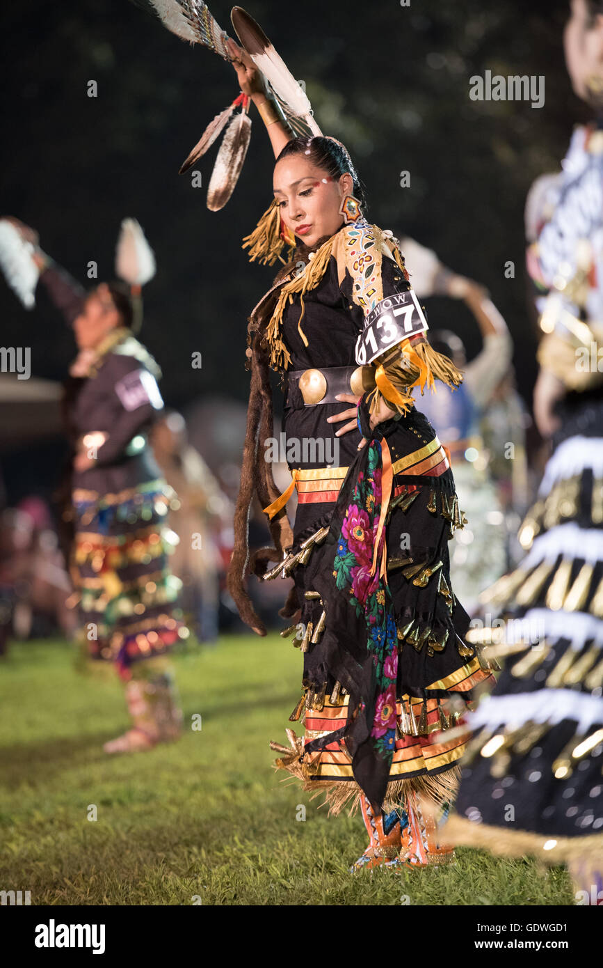 Native American woman performing jingle dress dance during Sac & Fox ...
