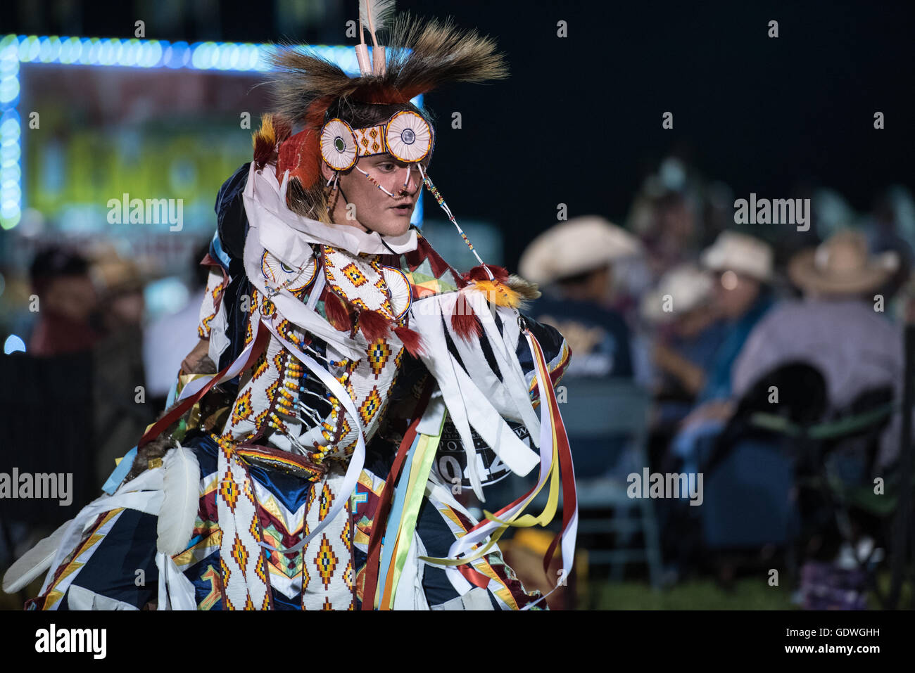 Native American man performing grass dance during Sac & Fox nation Pow ...