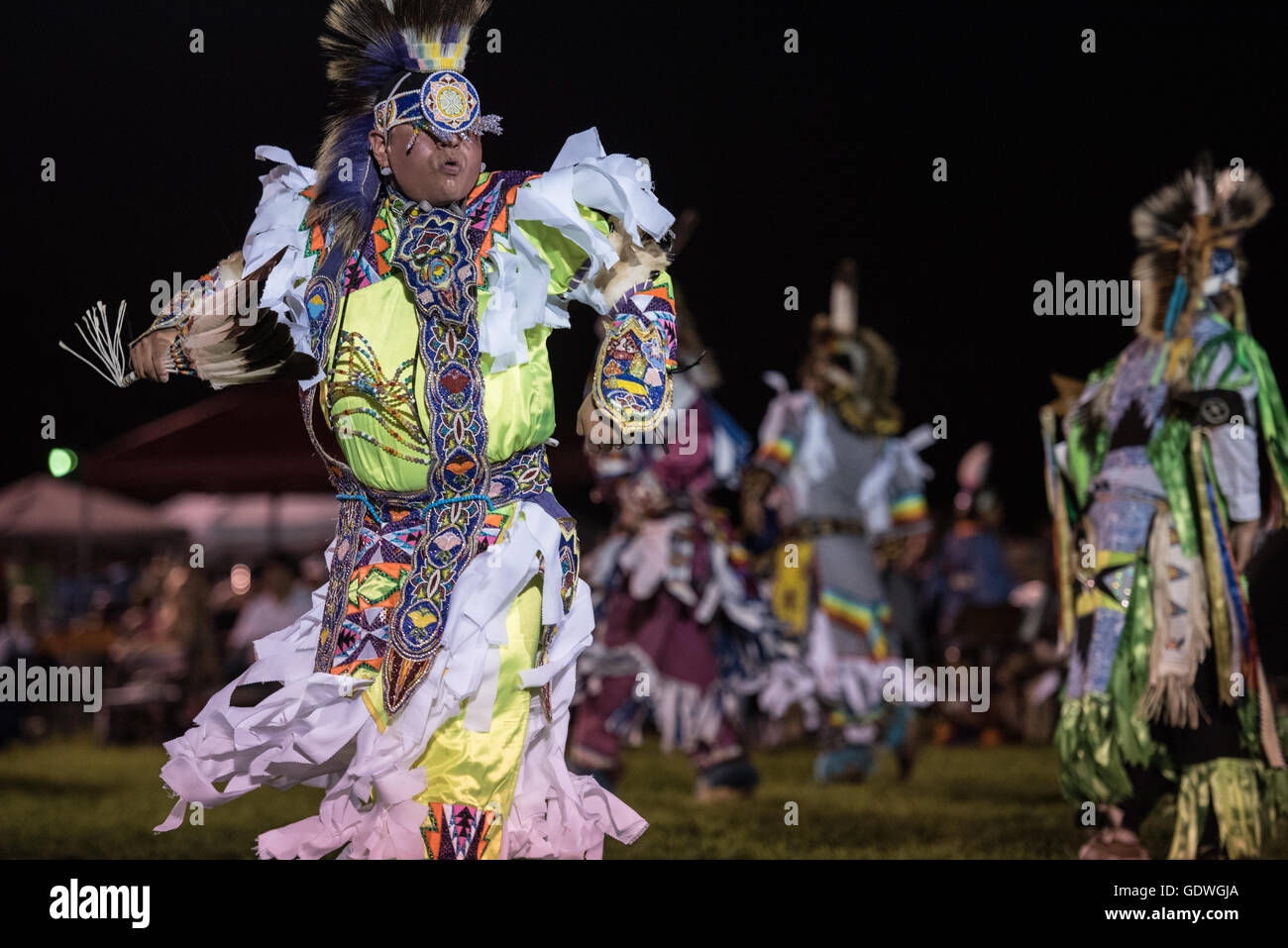 Native American man performing grass dance during Sac & Fox nation Pow ...