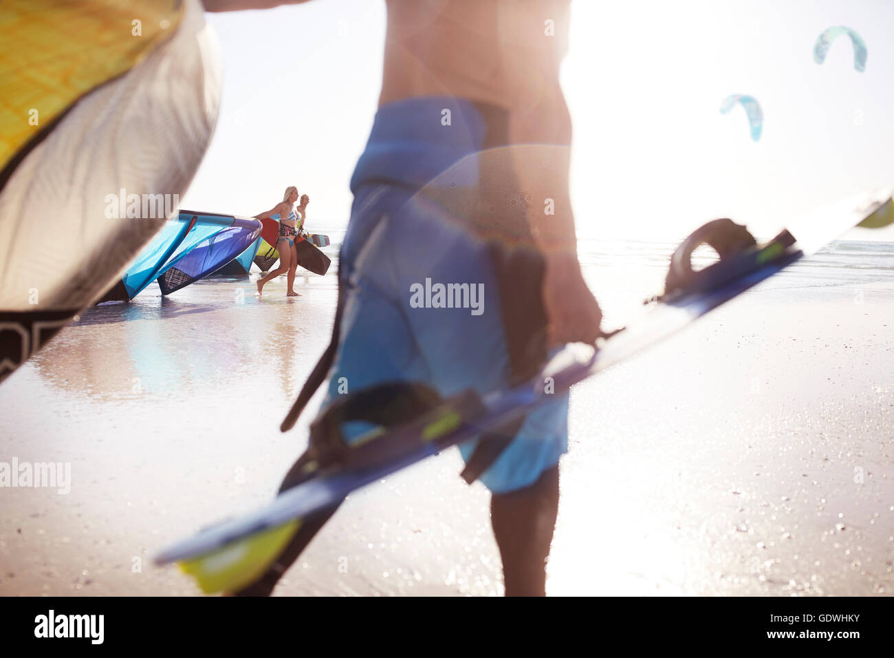 Kiteboarders on beach Stock Photo - Alamy