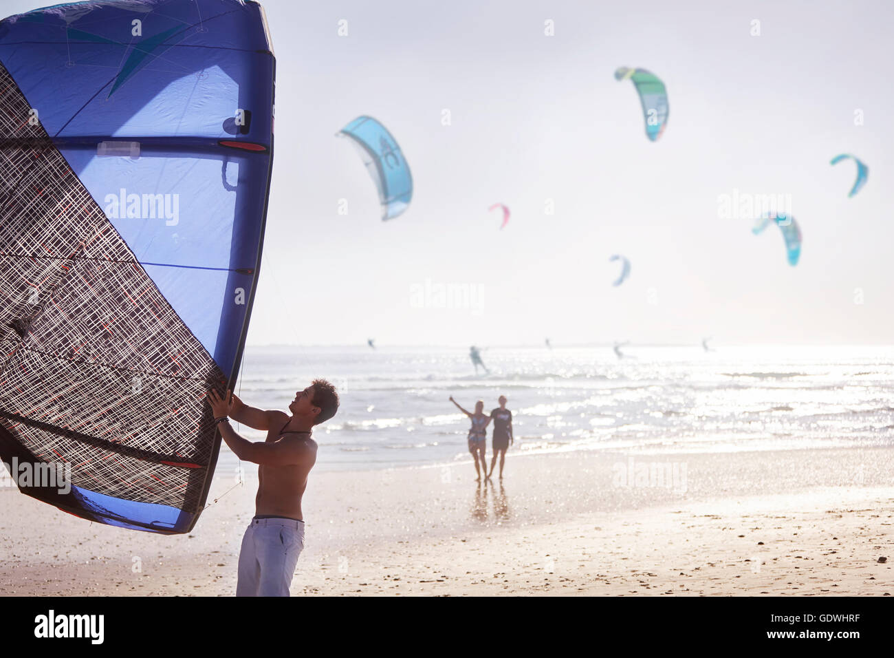 Kitesurfer beach holding kite in hi-res stock photography and images ...