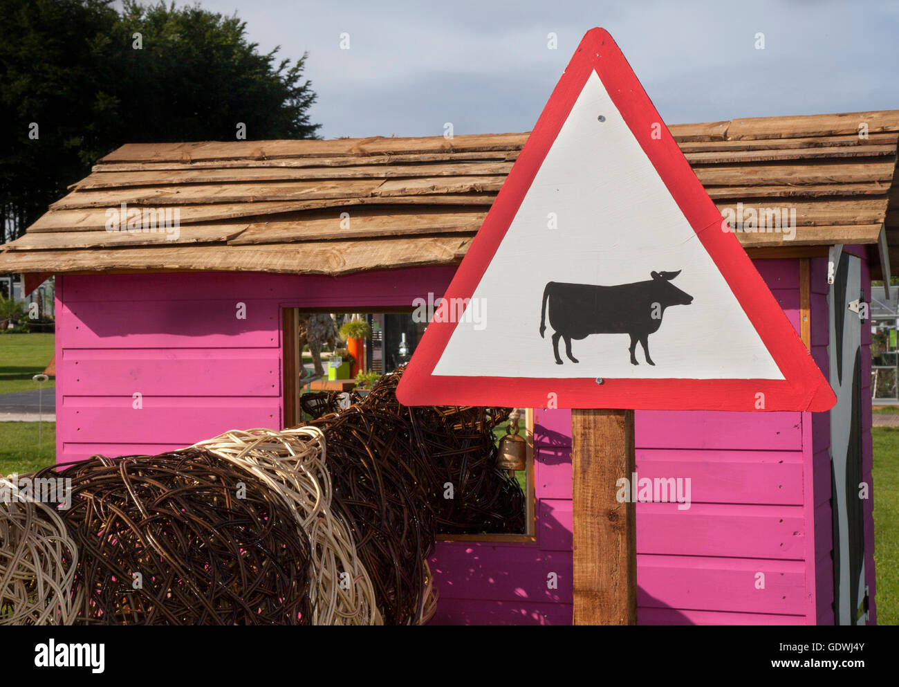 Warning cartoon cows crossing & red triangle sign on The Moo House ...
