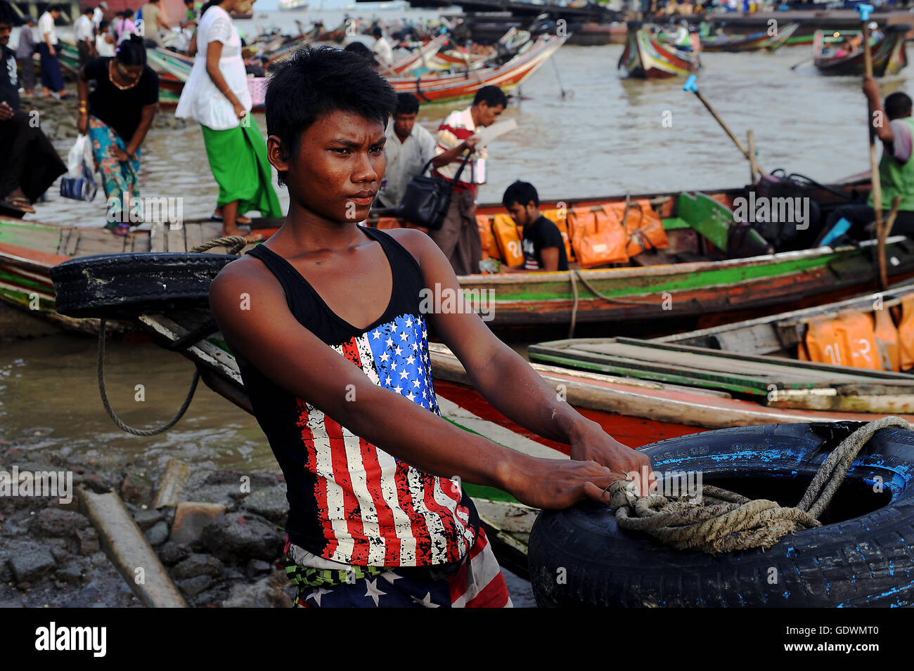 Boat boy at the pier Stock Photo - Alamy