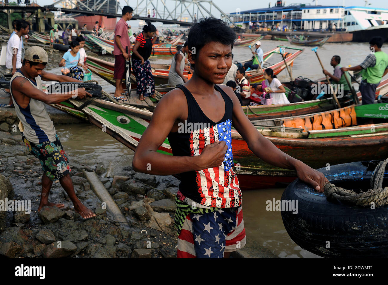 Boat boy at the pier Stock Photo - Alamy