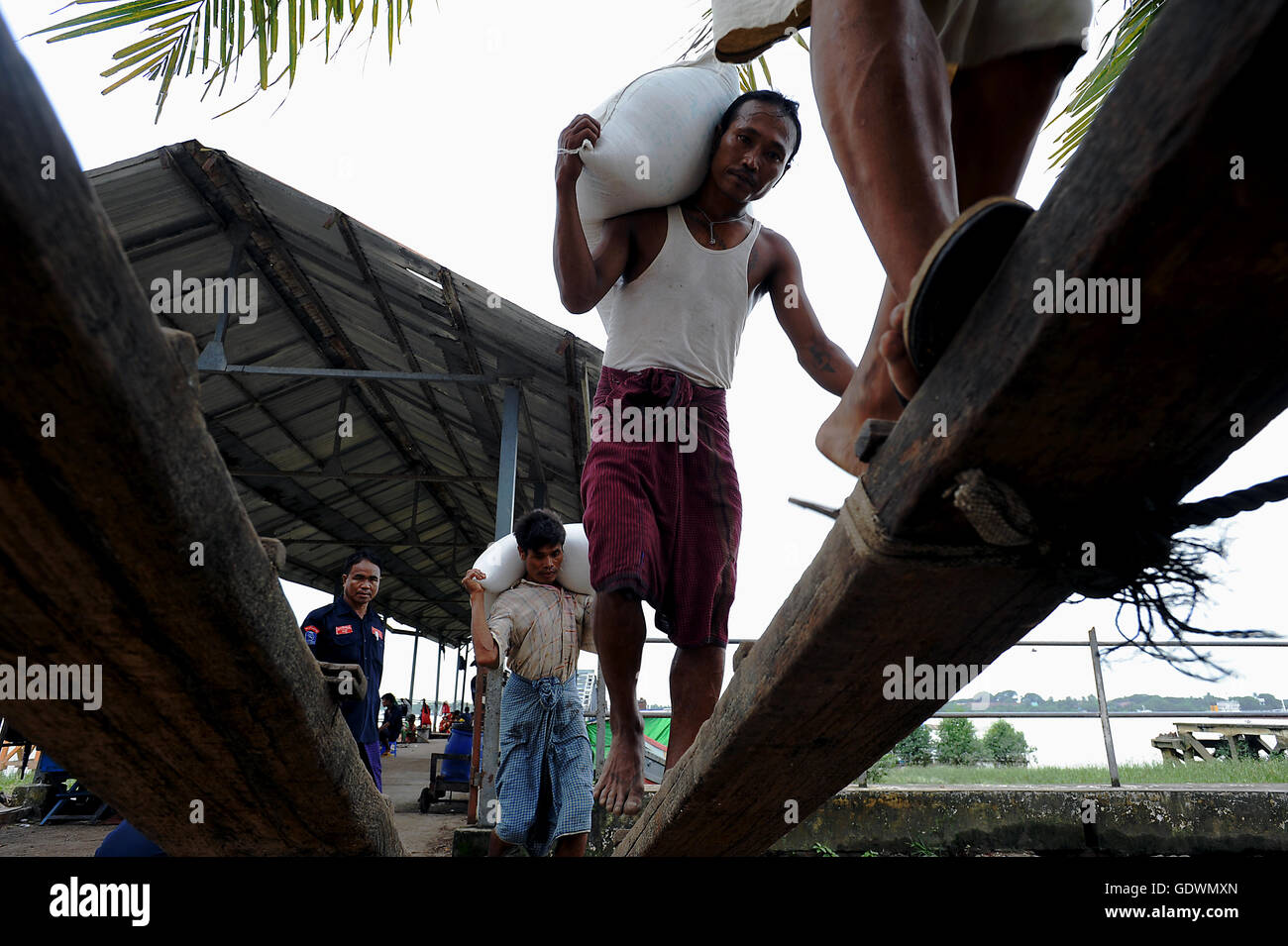 Loading rice sacks hi-res stock photography and images - Alamy