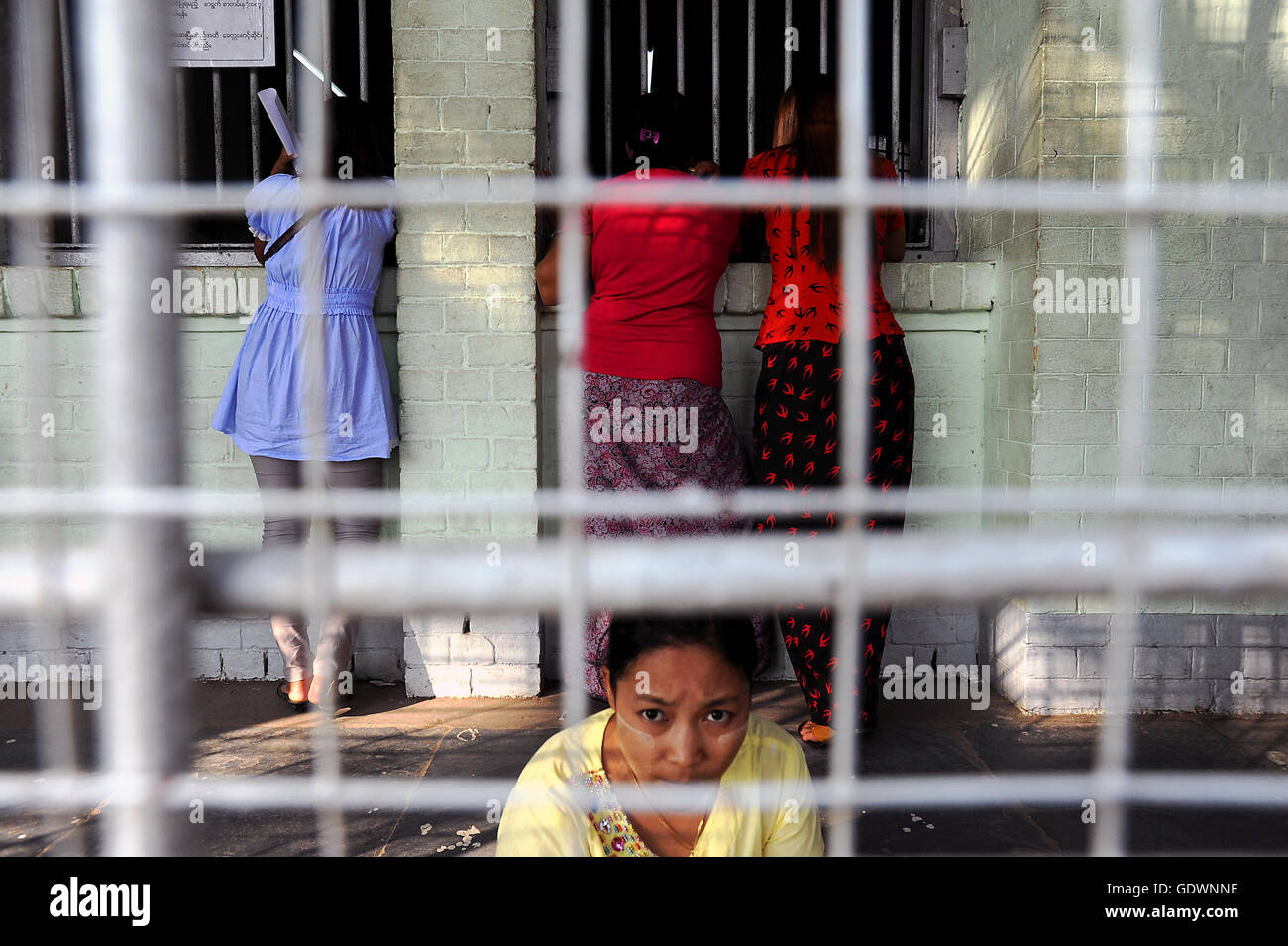 Woman behind window bars hi-res stock photography and images - Alamy