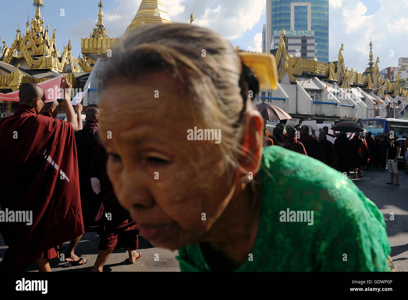 Old woman and monks Stock Photo - Alamy