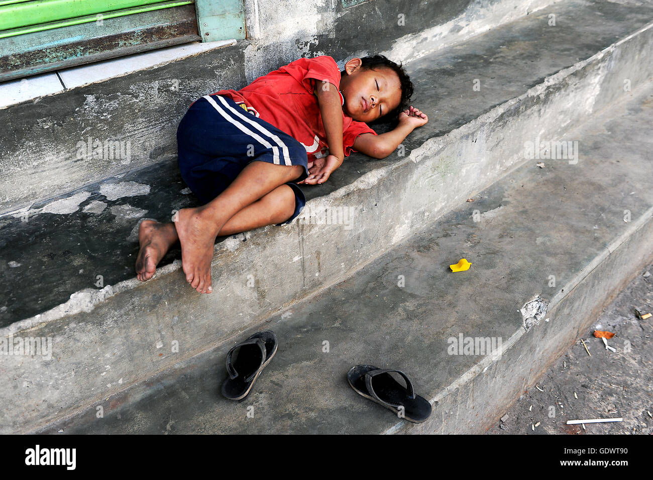 Sleeping street child Stock Photo - Alamy
