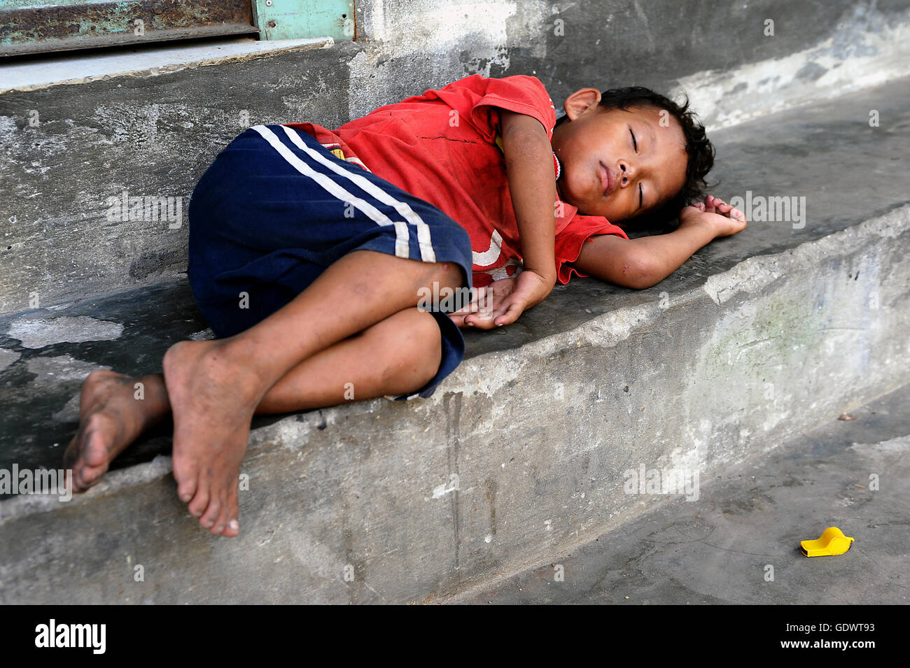 Poor barefoot kids in street hi-res stock photography and images - Alamy
