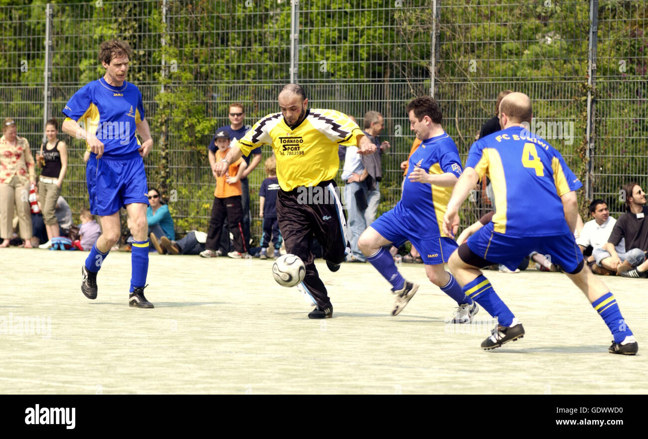 Imams and priests playing football Stock Photo - Alamy