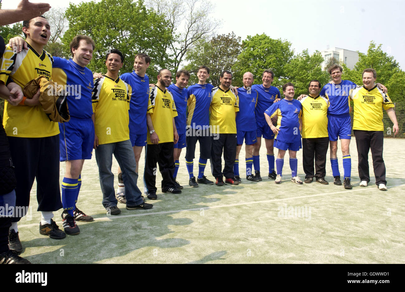 Imams and priests playing football Stock Photo - Alamy