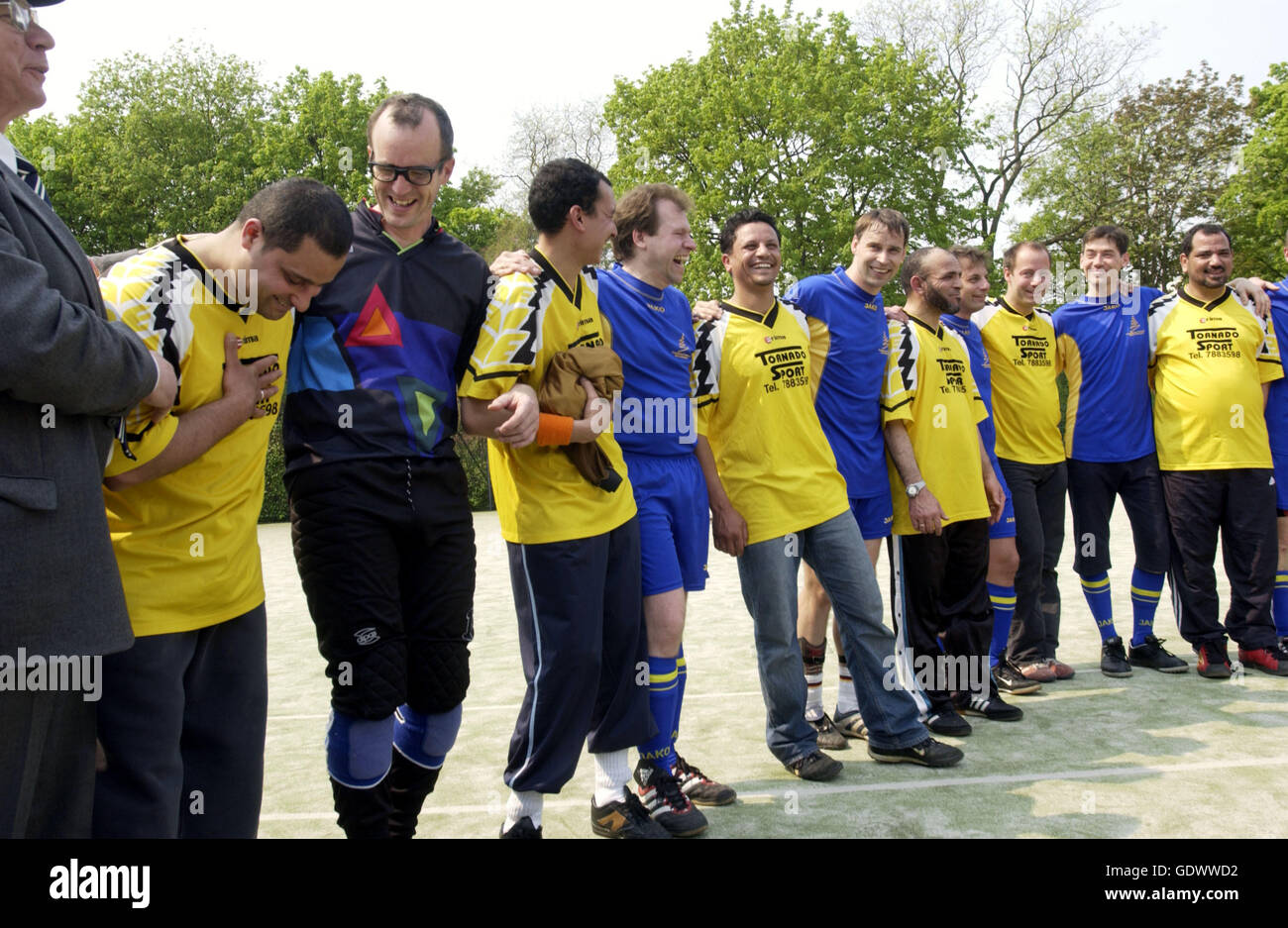 Imams and priests playing football Stock Photo - Alamy