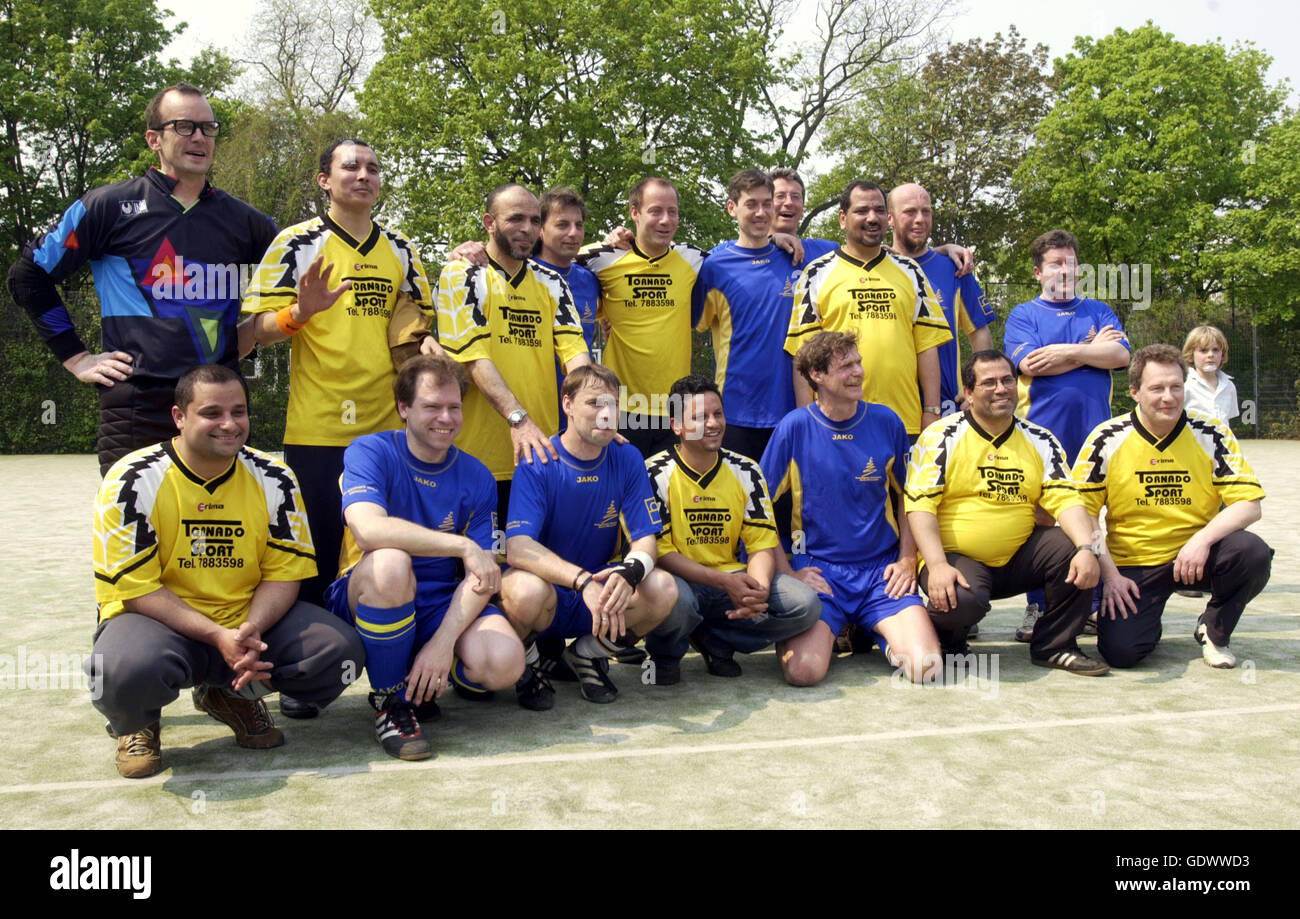 Imams and priests playing football Stock Photo - Alamy