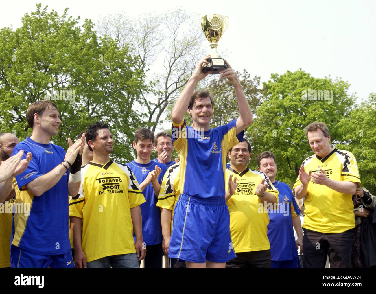 Imams and priests playing football Stock Photo - Alamy