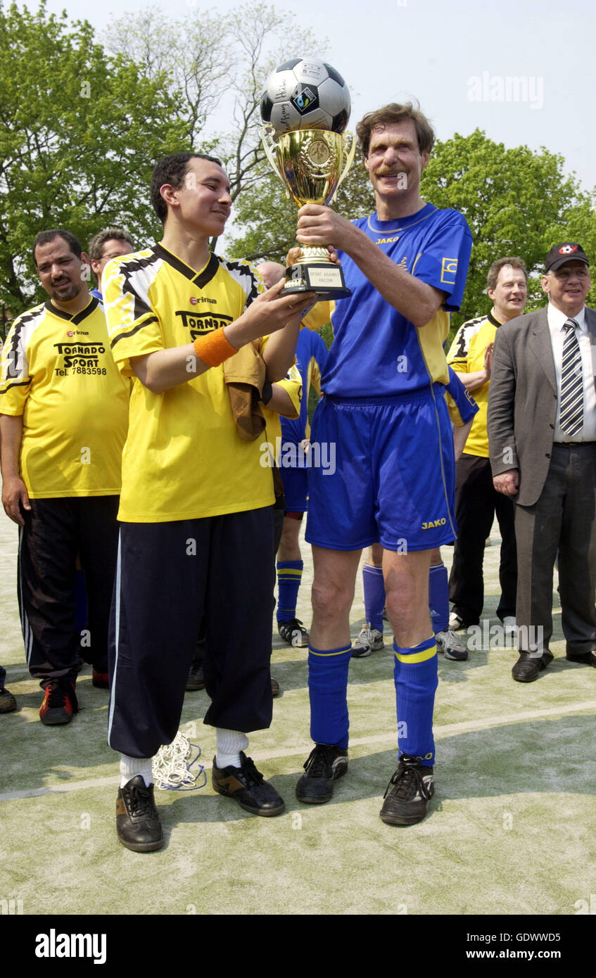Imams and priests playing football Stock Photo - Alamy