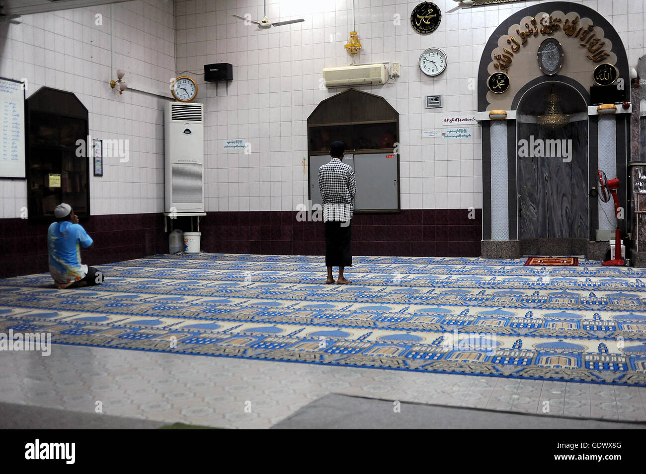 Two men are praying inside a mosque Stock Photo - Alamy