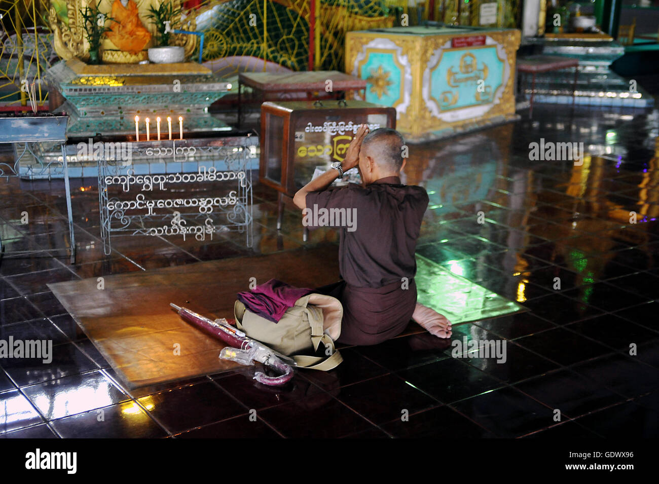 Buddhist man is praying inside a pagoda Stock Photo - Alamy