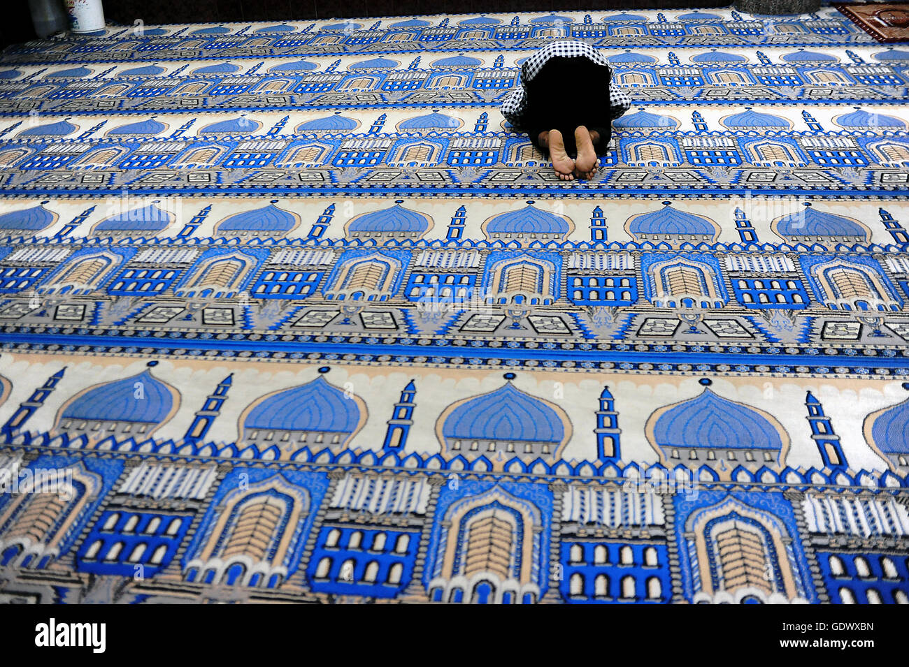 Man is praying inside a mosque Stock Photo - Alamy