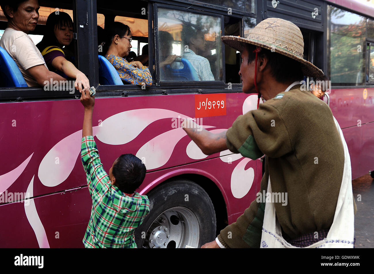 Begging father and son Stock Photo - Alamy