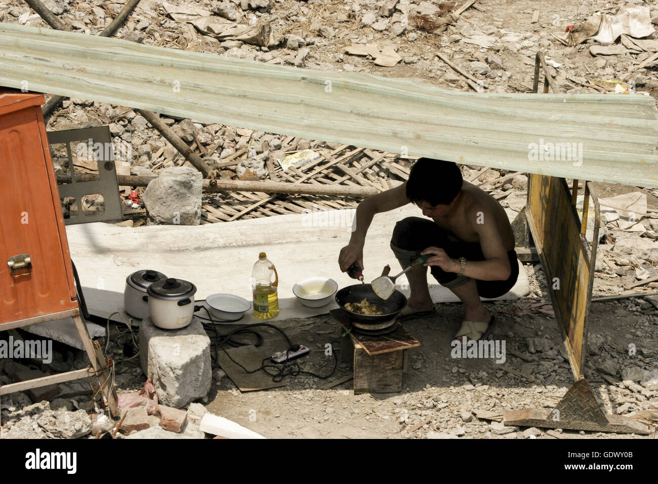 A chinese worker cook his lunch in a construction site hi-res stock ...