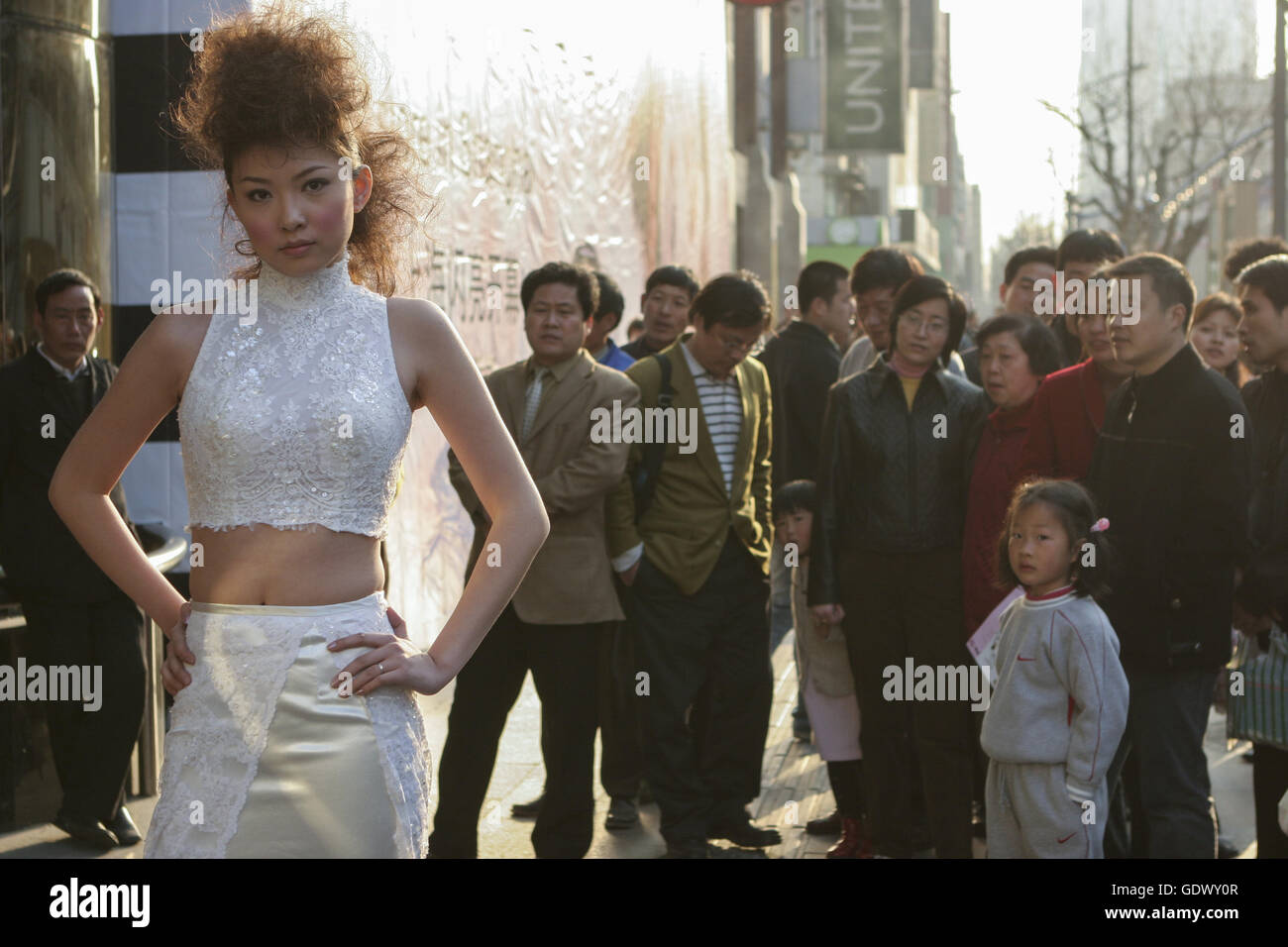 A fashion model works for a boutique show her clothing Stock Photo - Alamy