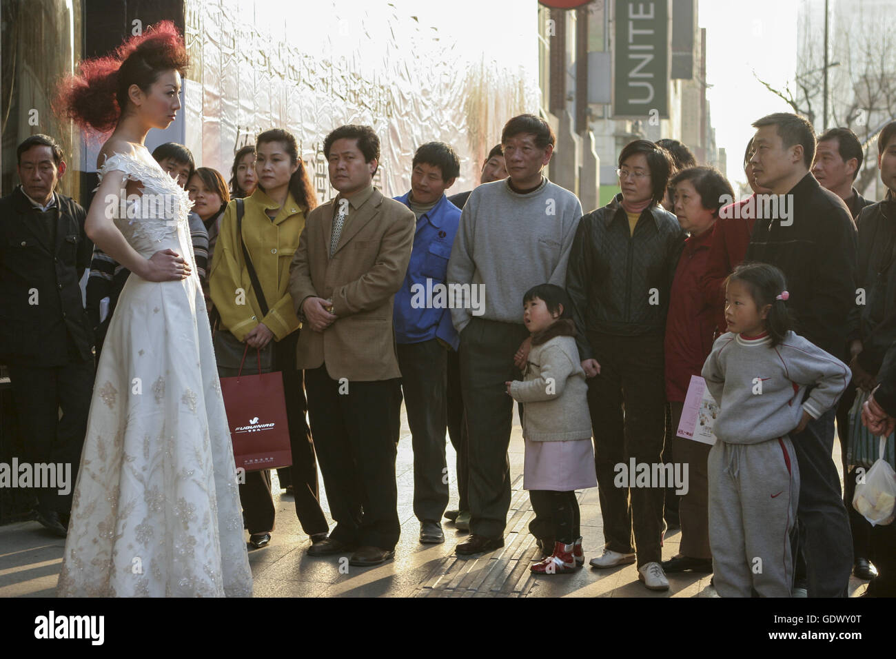 A fashion model works for a boutique show her clothing Stock Photo - Alamy