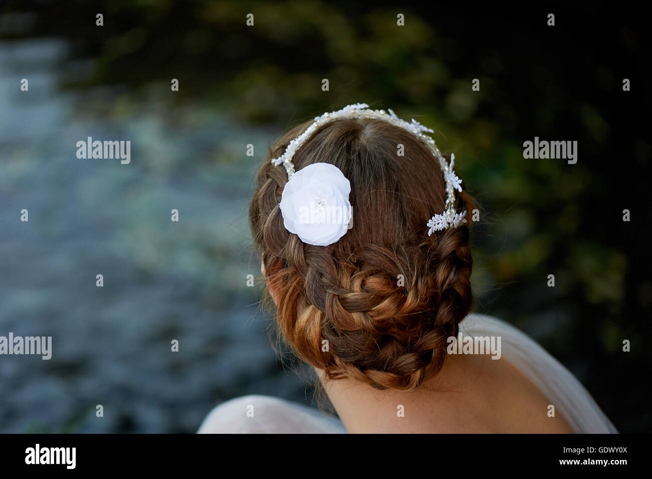 Hairstyle in a boho style with handmade lace. Closeup Stock Photo - Alamy