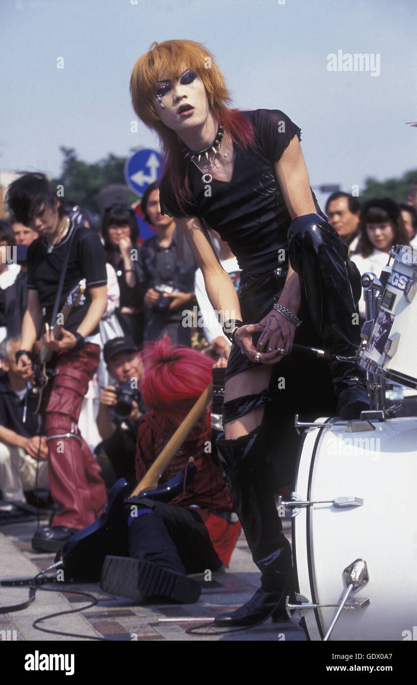 a Japanese Youth Punk Band plays on a square in the City of Tokyo in ...