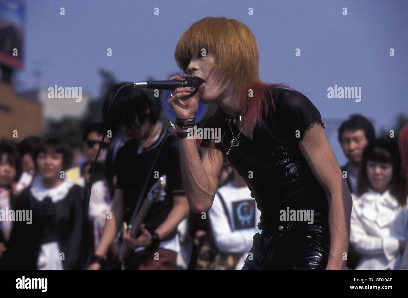 a Japanese Youth Punk Band plays on a square in the City of Tokyo in ...