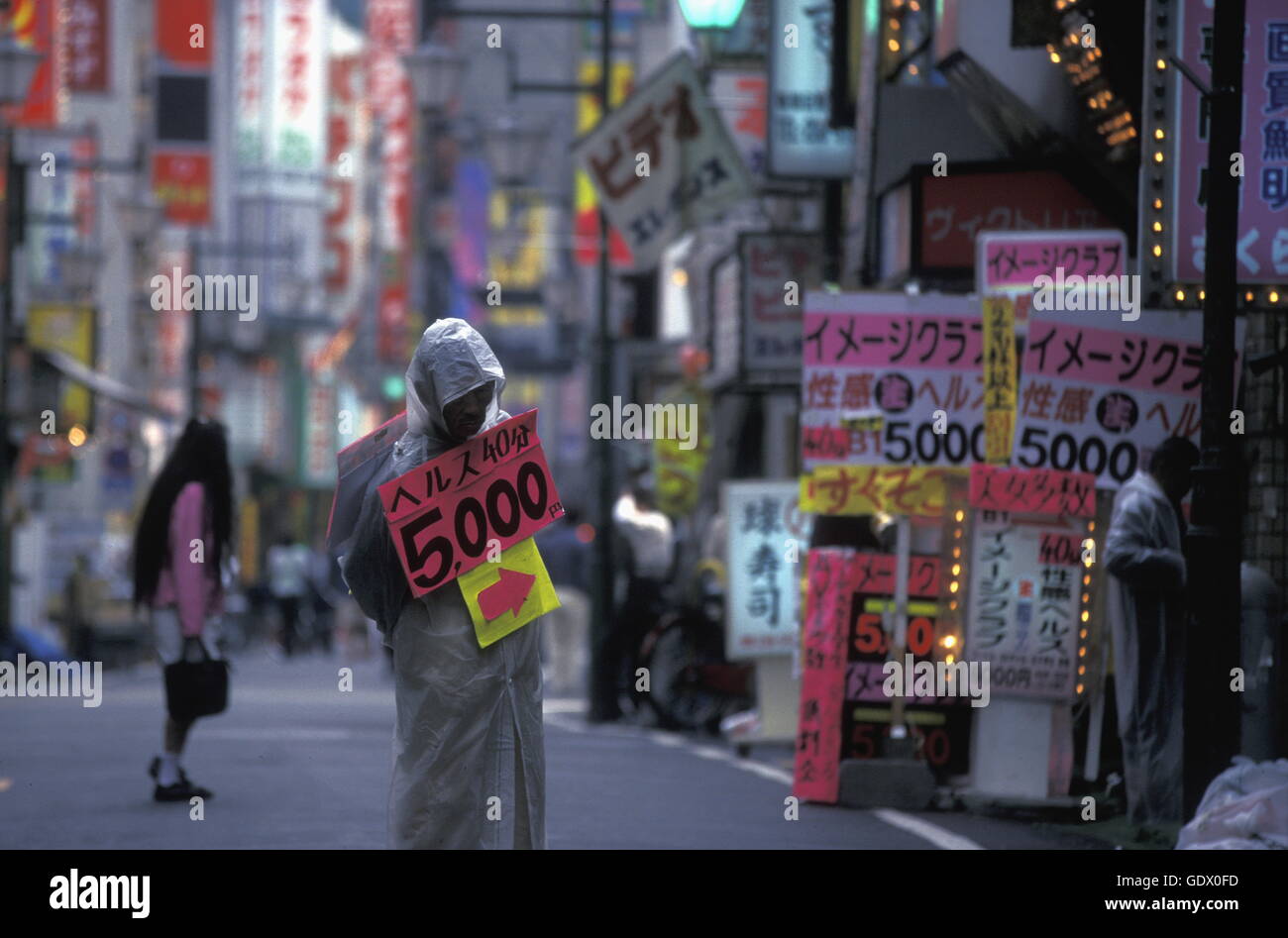 a streetworker in the city centre of Tokyo in Japan in Asia Stock Photo ...