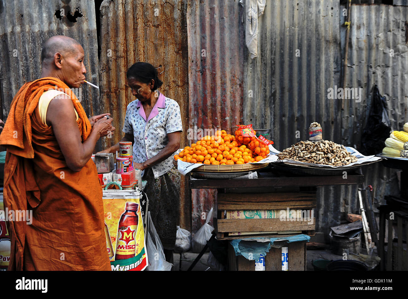 Buddhist monk smoking cigarette hi-res stock photography and images - Alamy