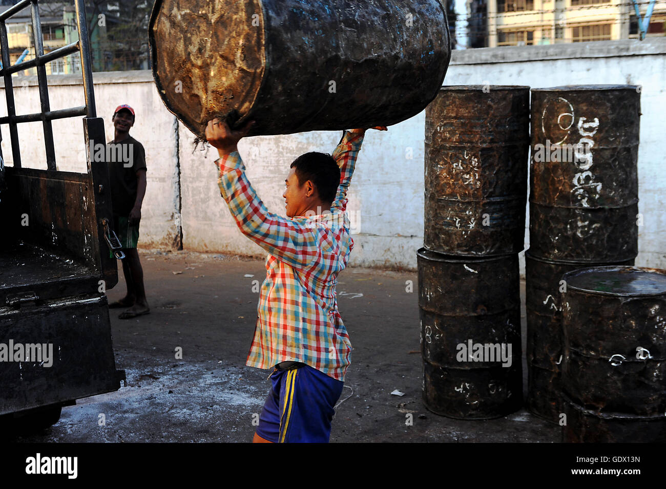 Carrying heavy barrel hi-res stock photography and images - Alamy