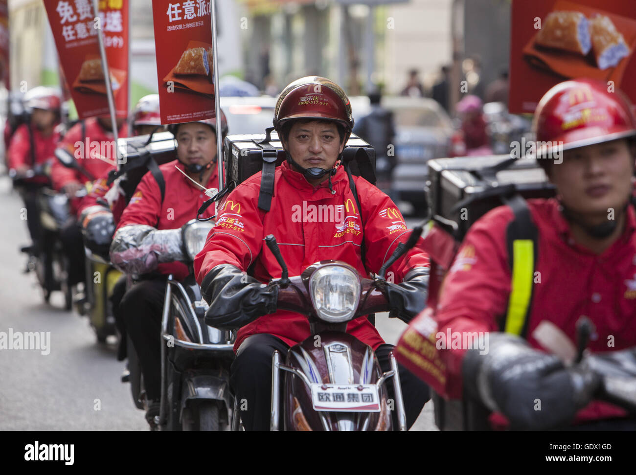 Delivery crew from Mcdonald's ride their motorcycles with banner ...