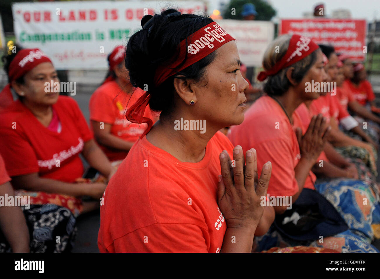 Praying for Win Tin Stock Photo - Alamy