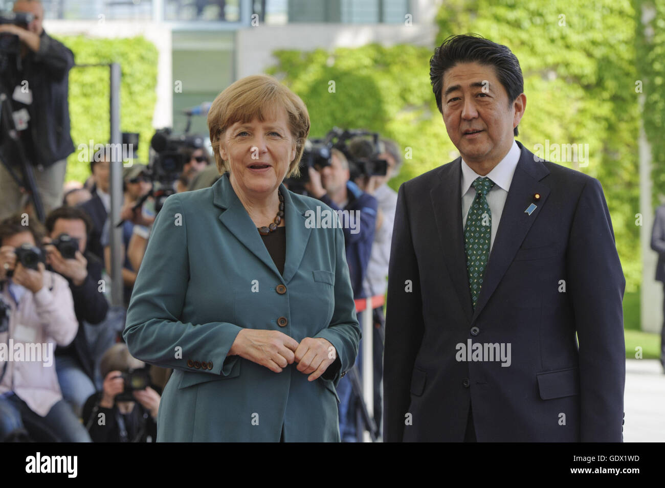 German Chancellor Angela Merkel welcomes Japanese Prime Minister Shinzo ...