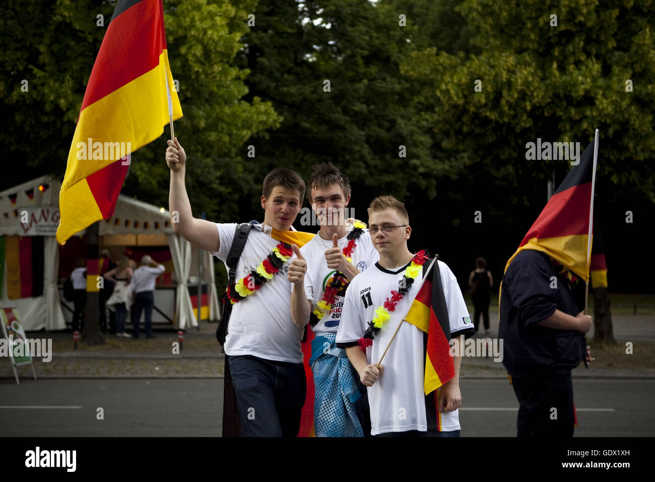 Young men poses on the German Fan Mile at the World Cup in Berlin ...