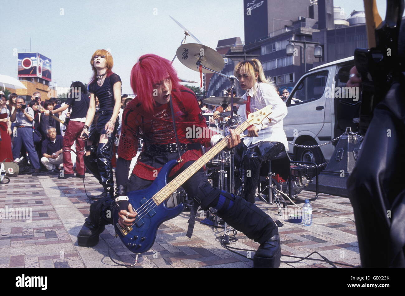 a Japanese Youth Punk Band plays on a square in the City of Tokyo in ...